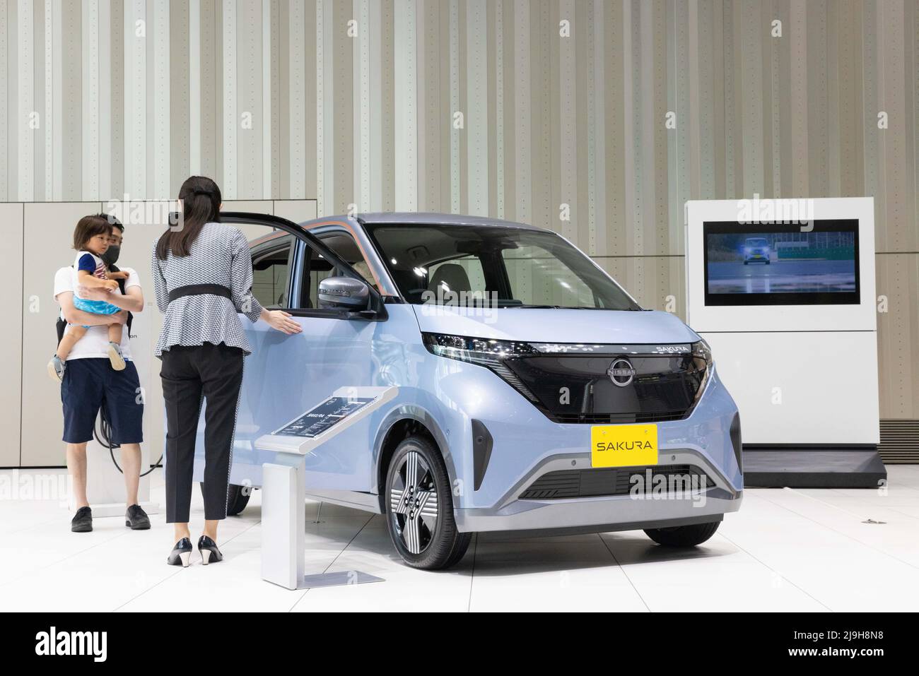 Visitors take a closer look at the new Nissan Sakura (zero emission ev ...