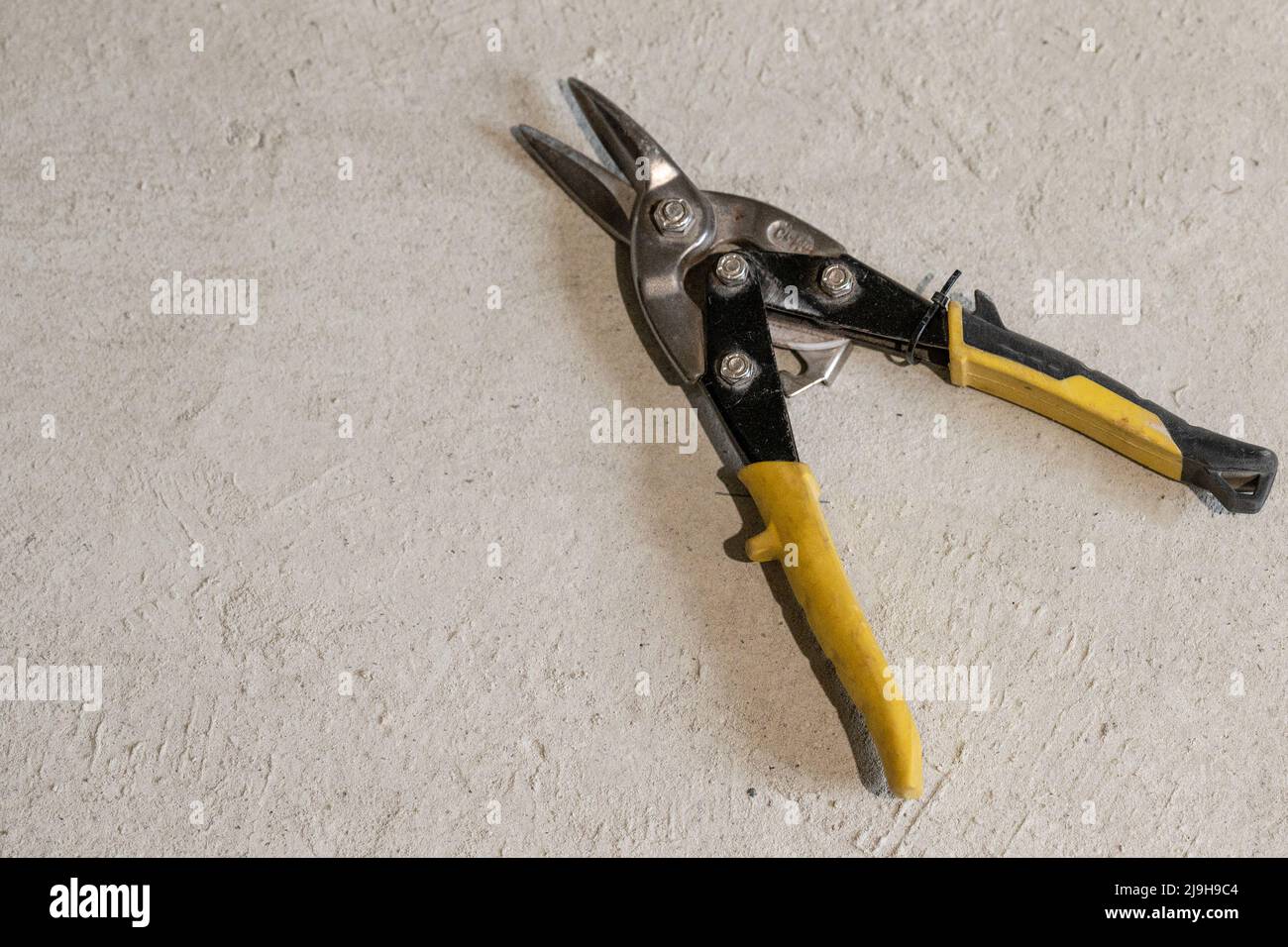 Scissors for cutting metal and metal building elements, scissors lie on ...
