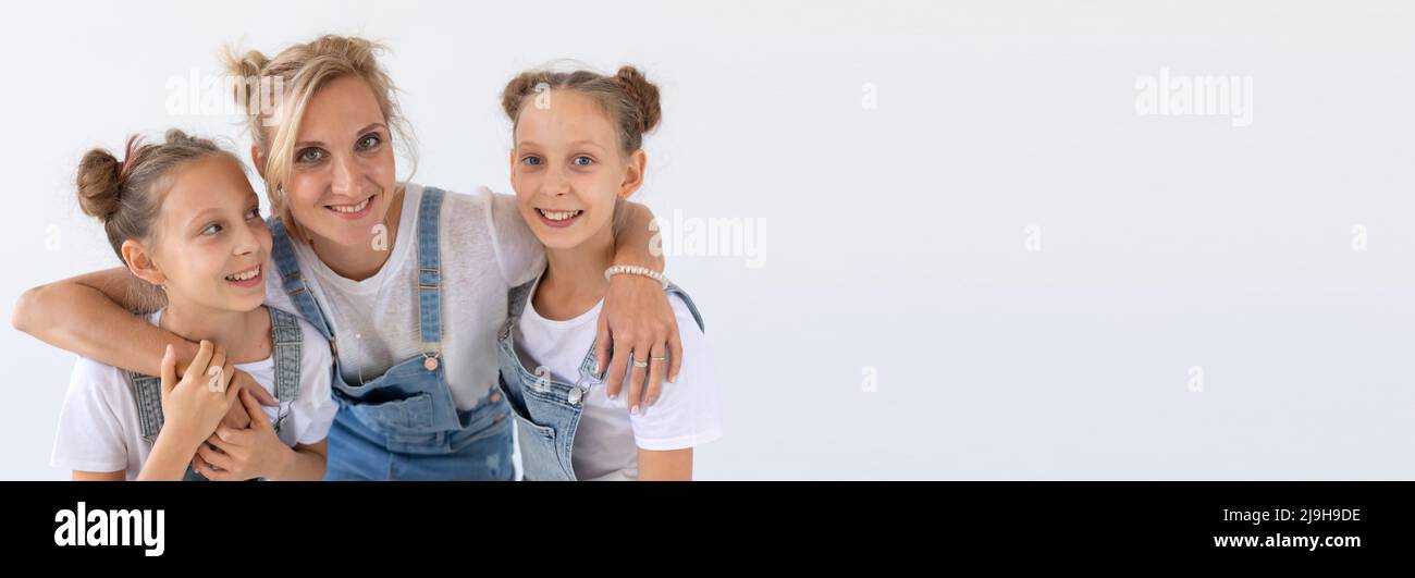 twins, family and children concept - portrait of a lovely mother ...