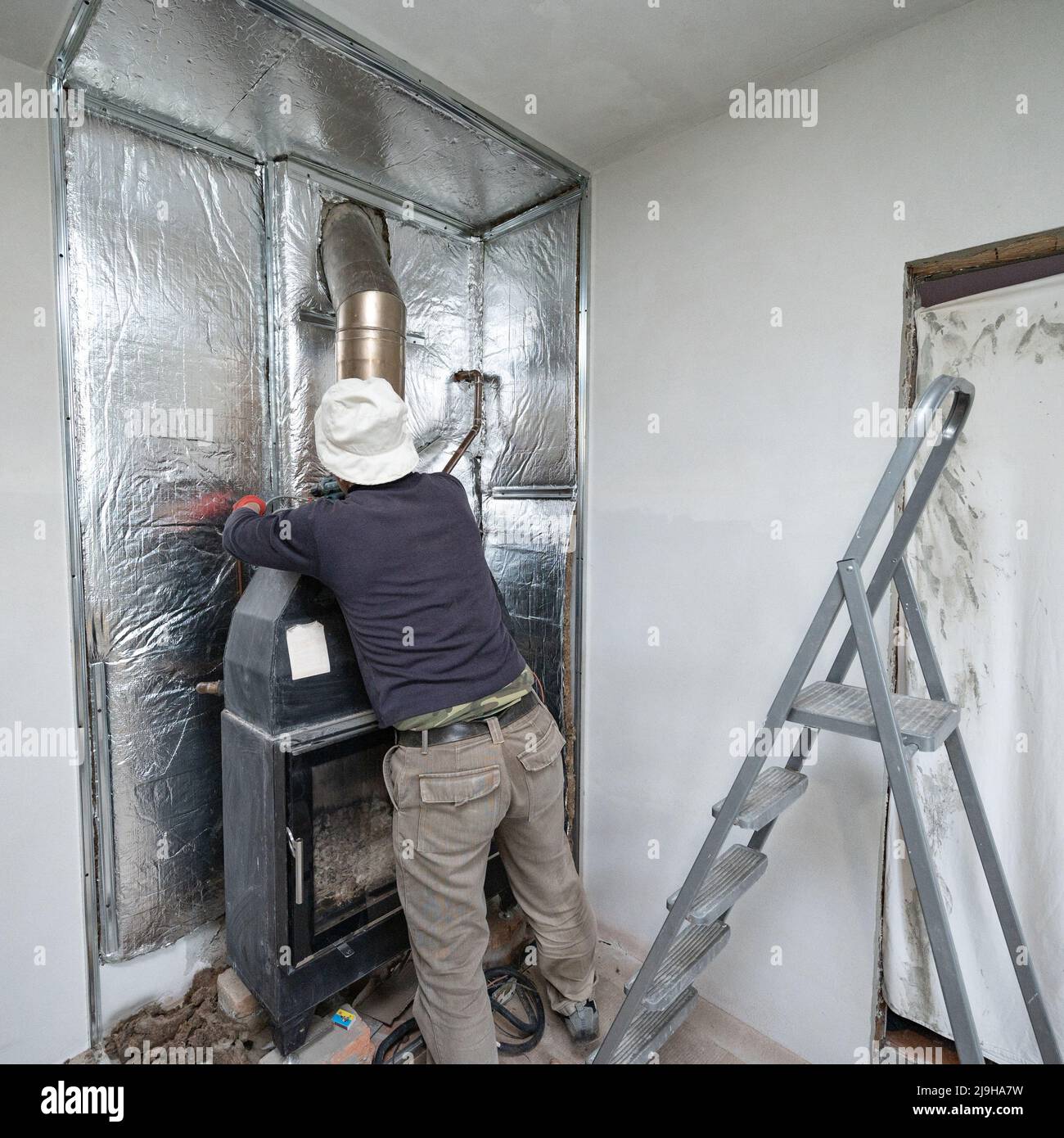 mounting on the walls of metal profile and mineral wool for thermal ...