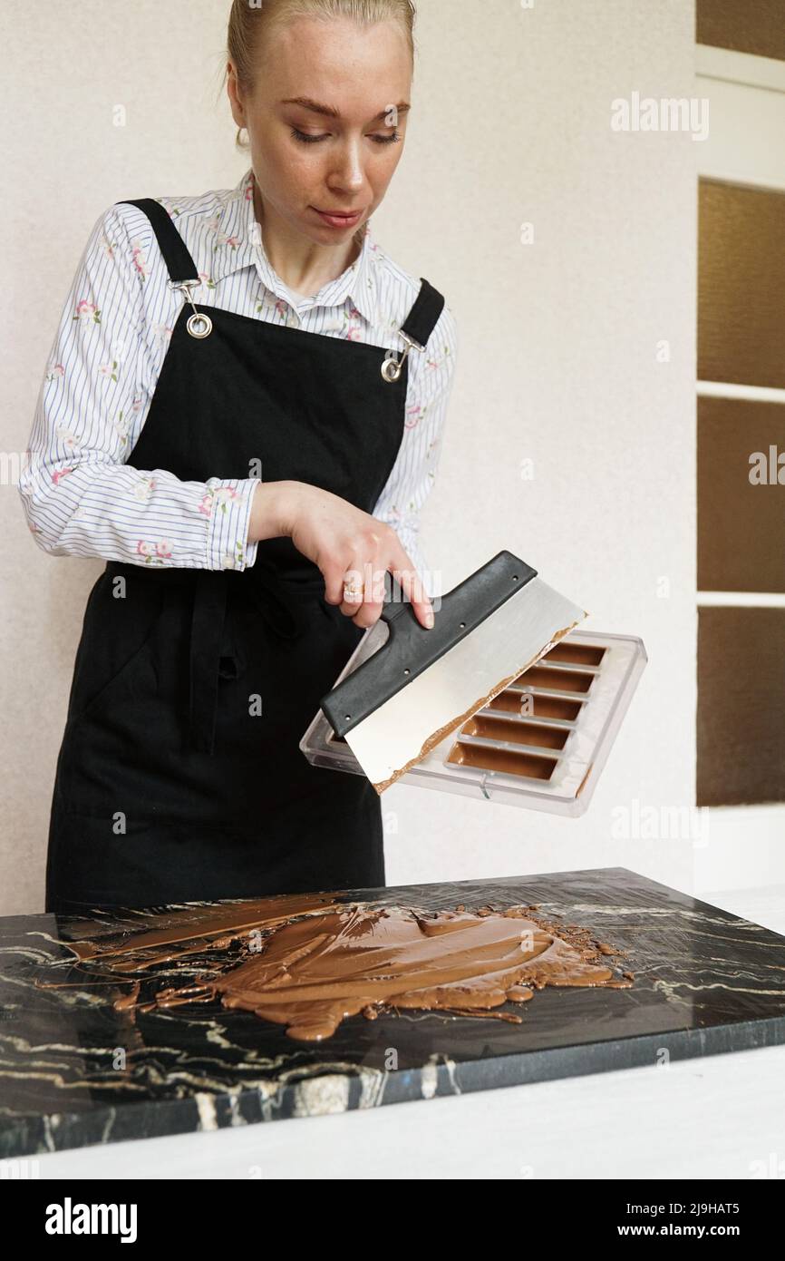 Hand mixing melted dark chocolate hi-res stock photography and images ...