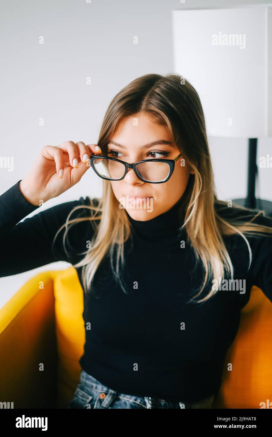Beautiful woman trying on eyeglasses hi-res stock photography and ...