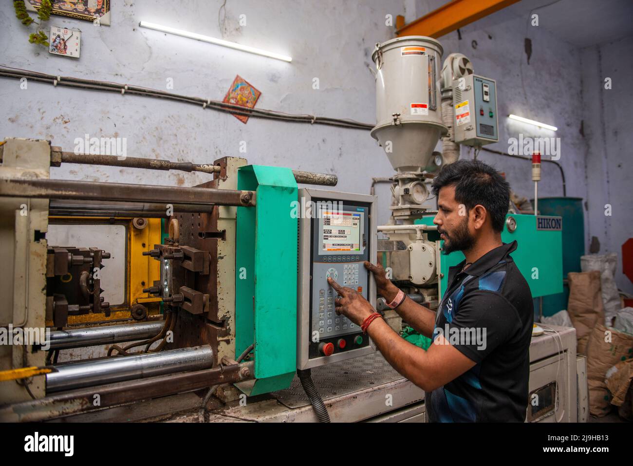 Worker operates automatic molding hi-res stock photography and images ...