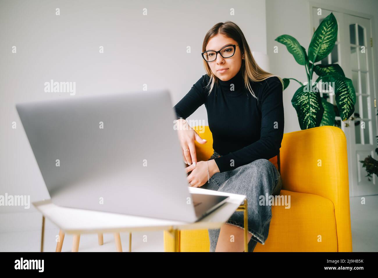 Caucasian businesswoman having video call on laptop, online ...