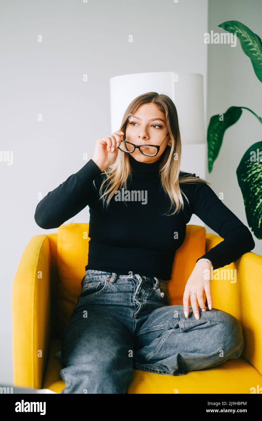 Young caucasian woman trying on glasses in a opticians store Stock ...