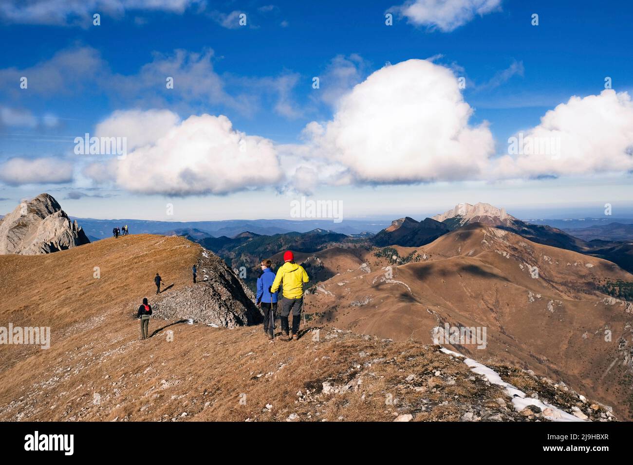 Group of travelers in the mountains. Back view Stock Photo - Alamy