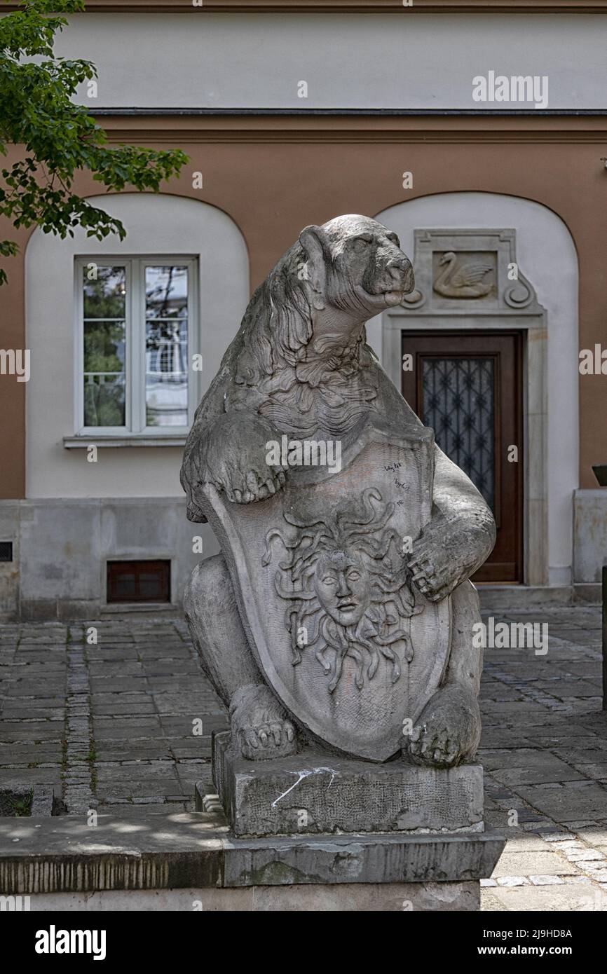 WARSAW, POLAND - MAY 17, 2022: Statue of bear with shield with Gorgon ...