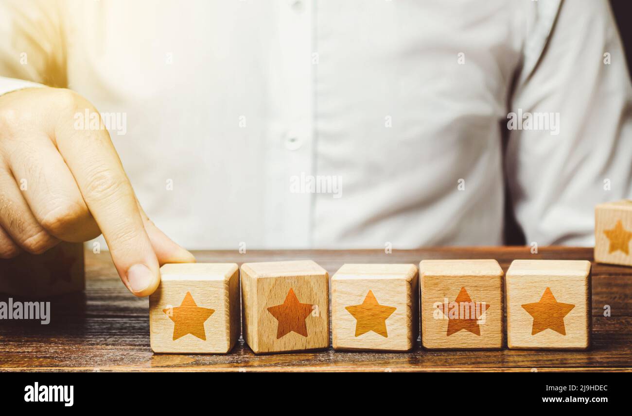 A man gives 5 star ratings. Assessment of quality and service ...