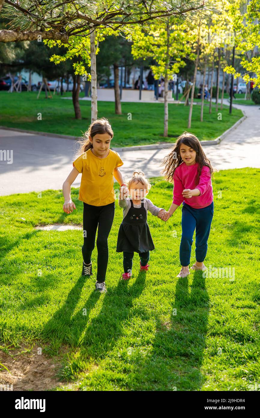 Children walk together in a friend's folder. Selective focus Stock ...