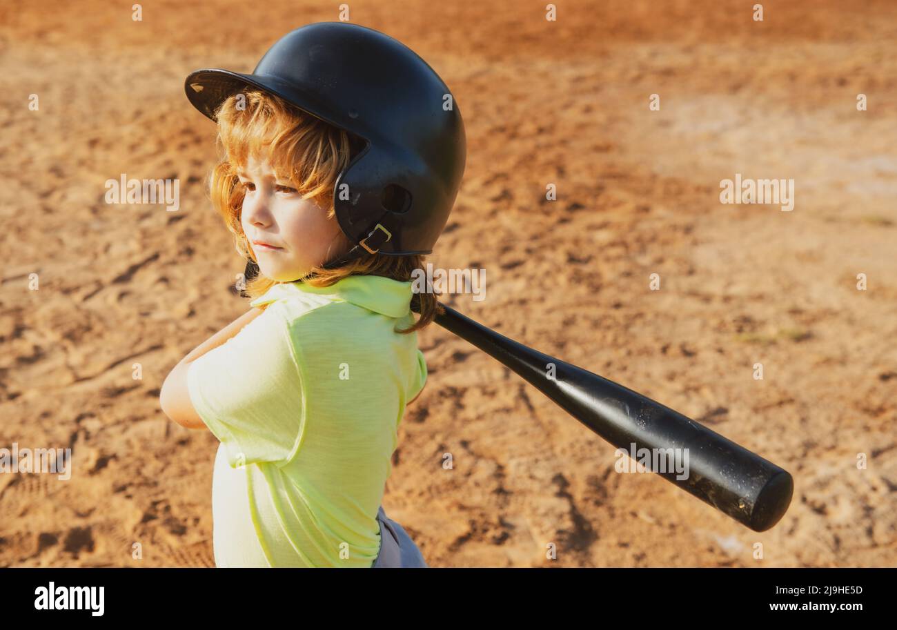 Child baseball player focused ready to bat. Kid holding a baseball bat ...