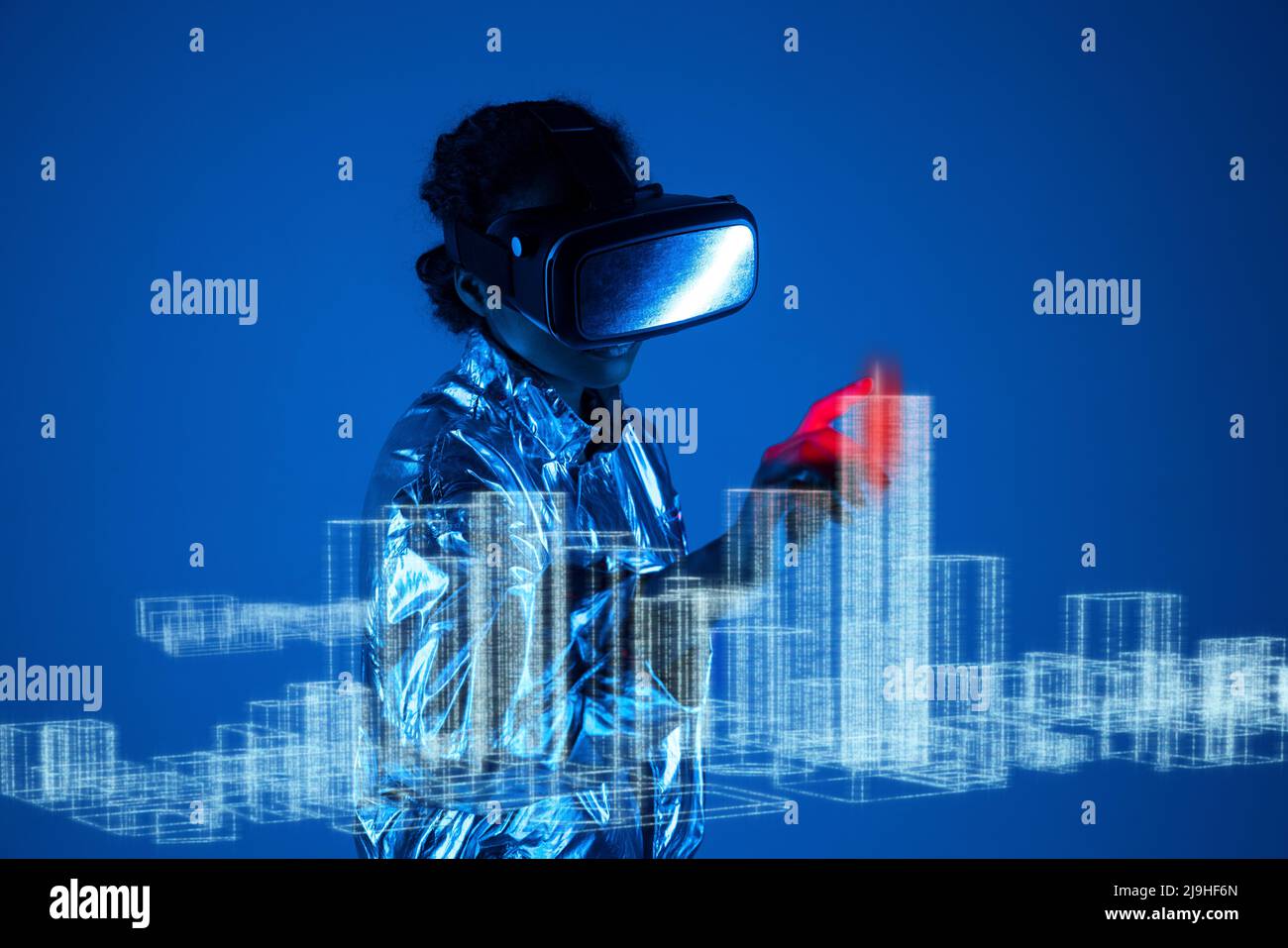 Woman wearing virtual reality simulator touching graph on screen ...