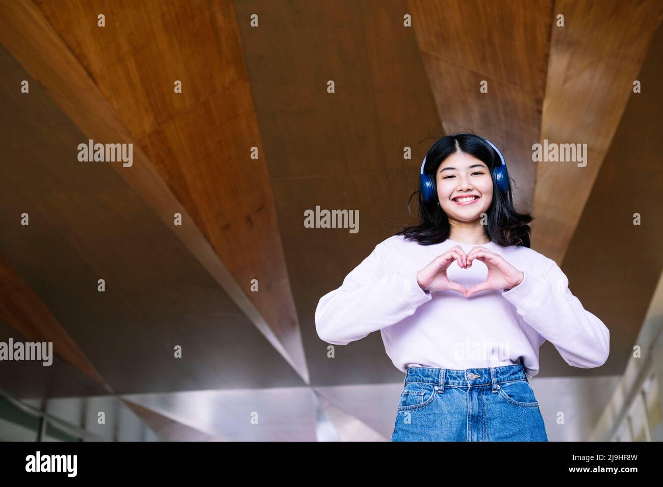 Asian woman showing heart sign hi-res stock photography and images - Alamy