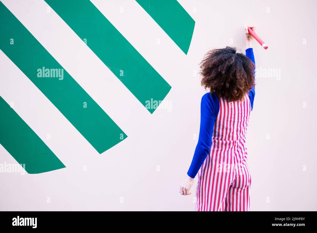 Woman writing on wall hi-res stock photography and images - Alamy