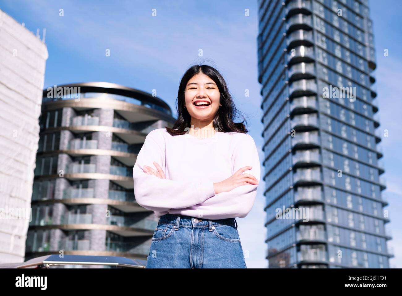 Happy asian woman laughing standing hi-res stock photography and images ...