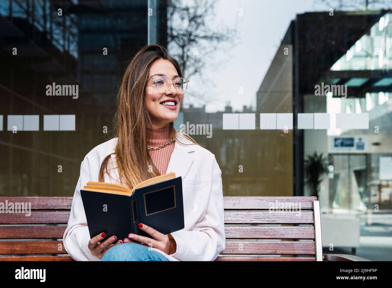 Woman sitting bench front view hi-res stock photography and images - Alamy