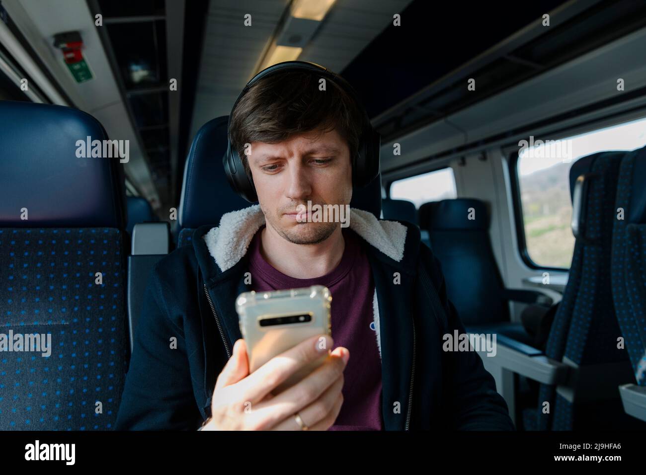 Man sitting on train railway hi-res stock photography and images - Alamy
