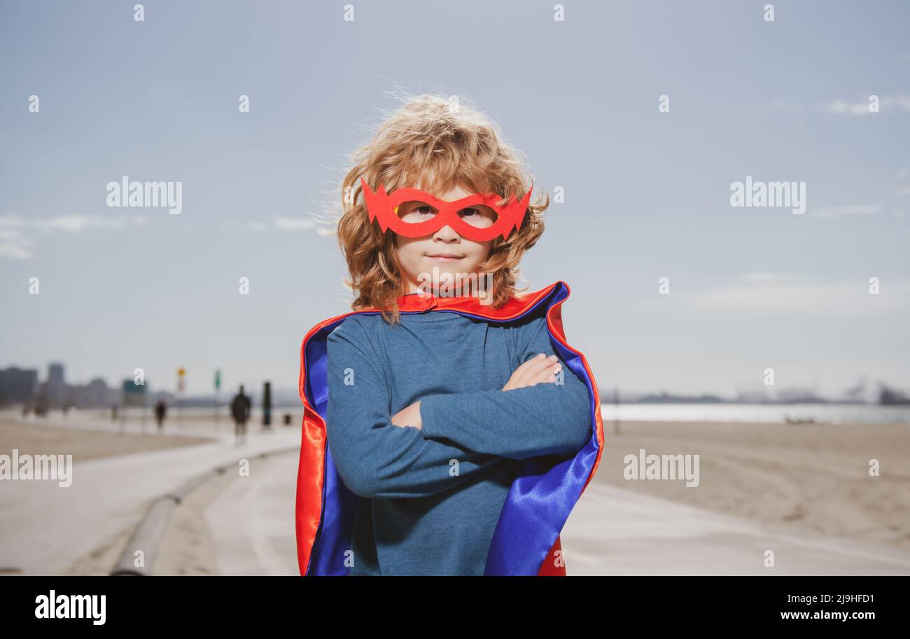Portrait of child wearing a superhero costume. Super hero child against ...