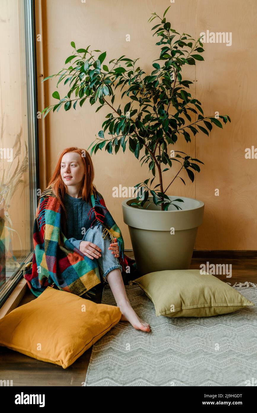 Pensive young female wrapped hi-res stock photography and images - Alamy