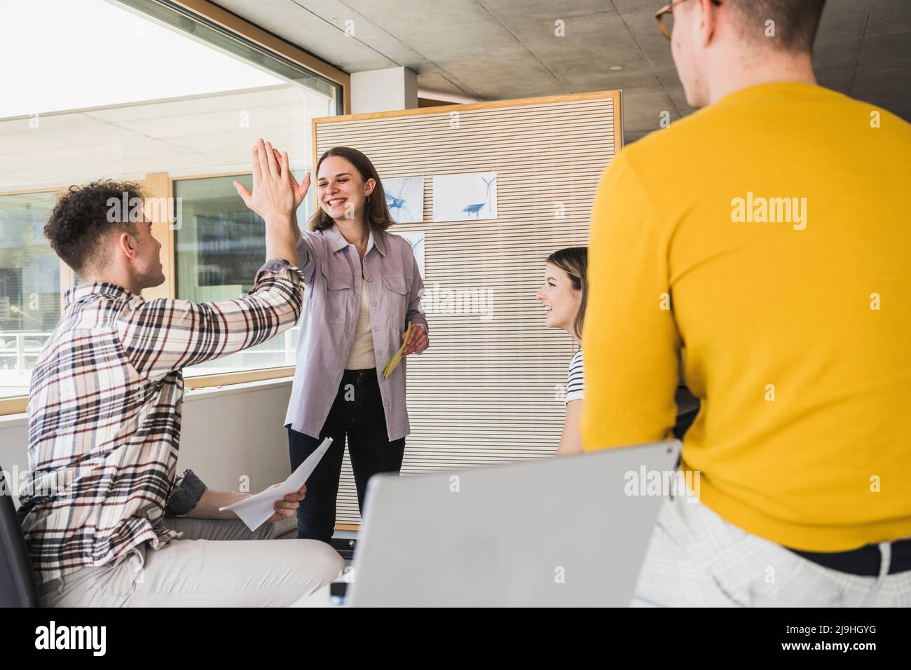 High fiving team in hi-res stock photography and images - Alamy