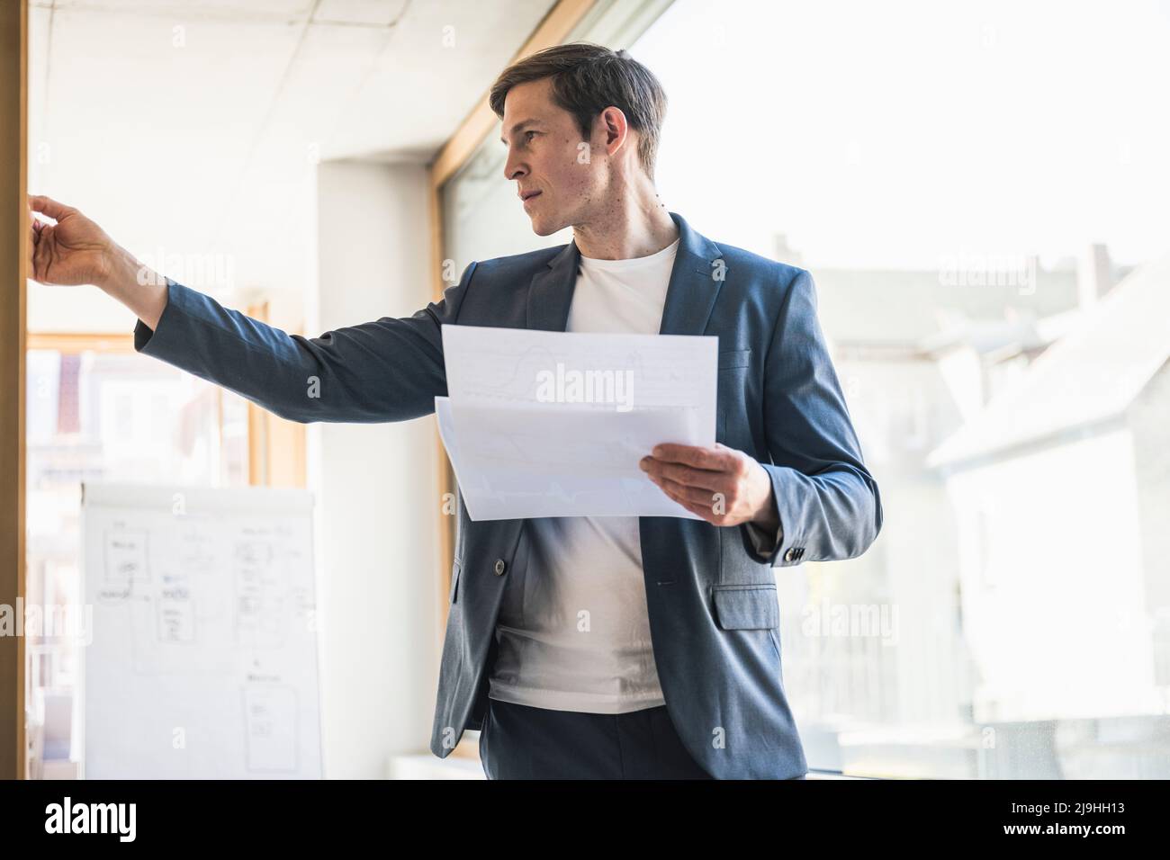 Men holding documents hi-res stock photography and images - Alamy