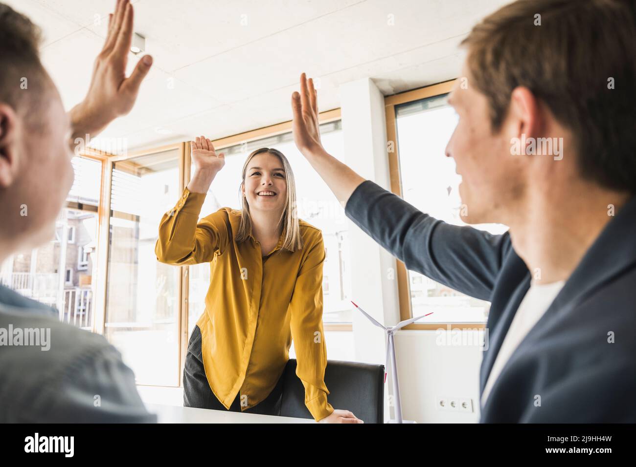 High fiving team in hi-res stock photography and images - Alamy