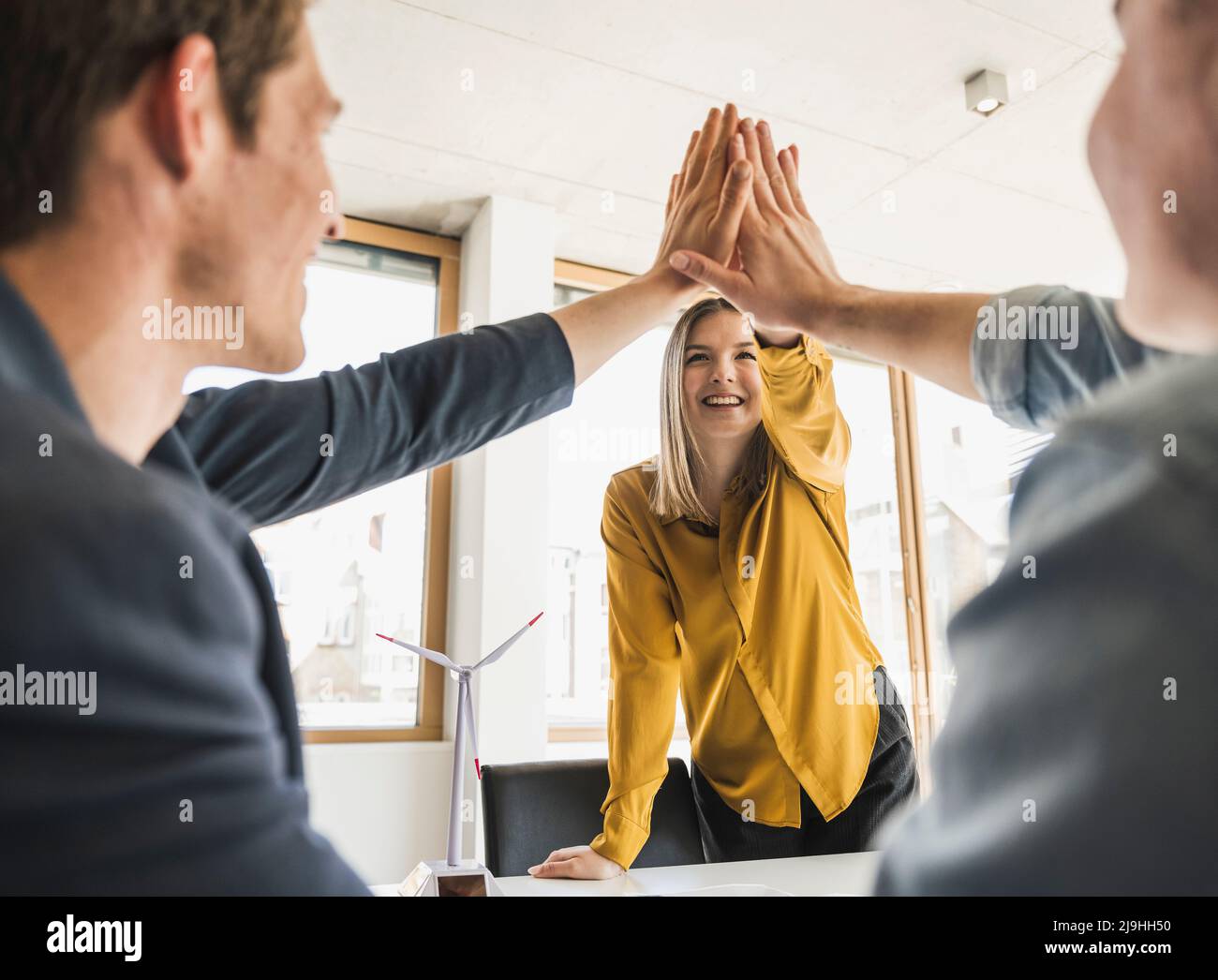 High fiving team in hi-res stock photography and images - Alamy