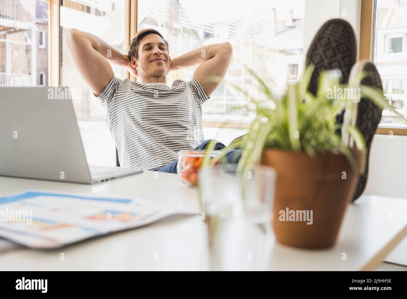 Businessman desk office leaning back hi-res stock photography and ...