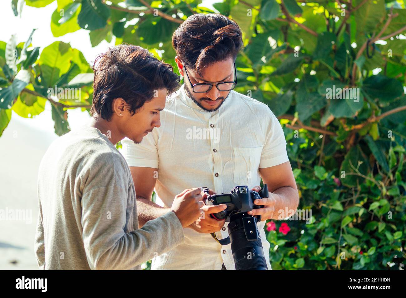 handsome and confident indian man photographer with a large ...