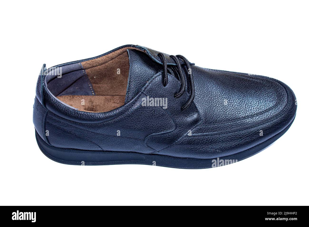 Single leather men's shoe isolated on white background. Closeup photo ...