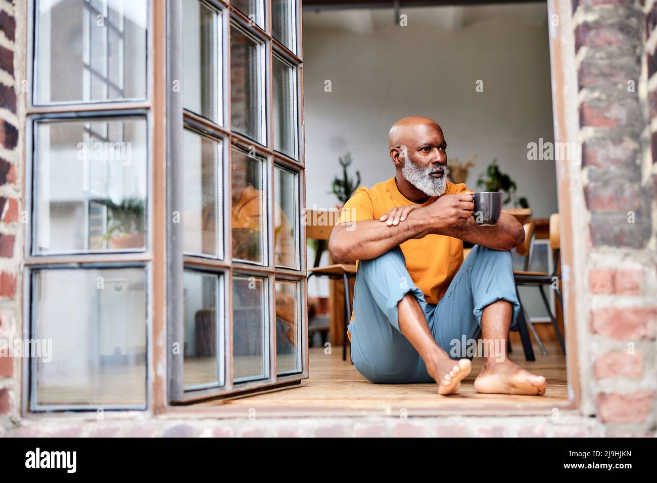 Thoughtful bald man hi-res stock photography and images - Alamy