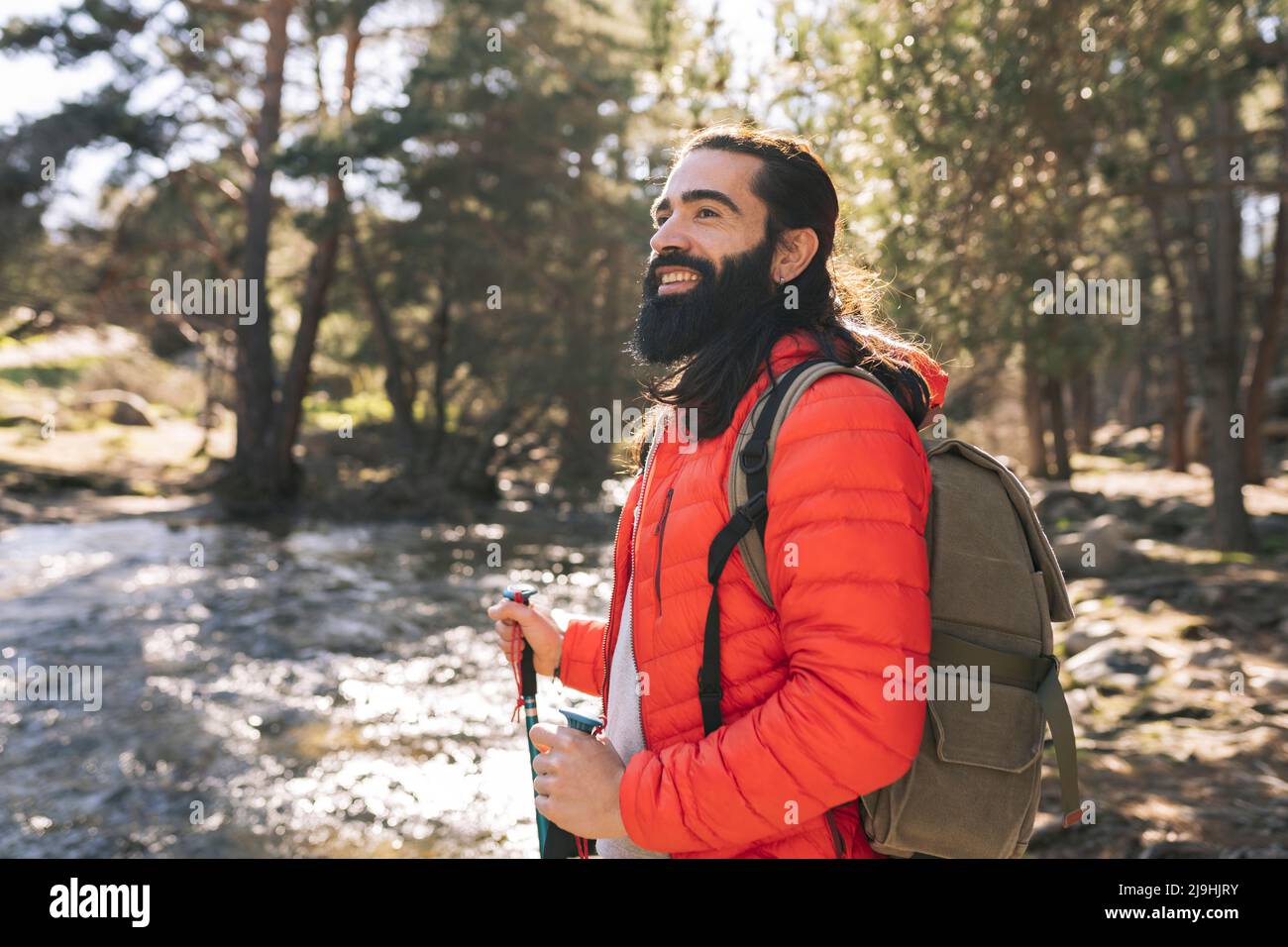 Man wearing backpack standing hi-res stock photography and images - Alamy