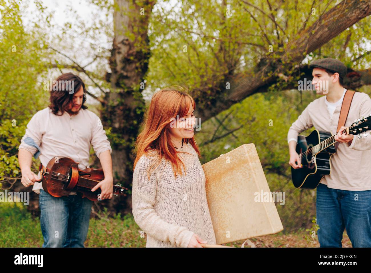 Woman playing musical instruments hi-res stock photography and images ...