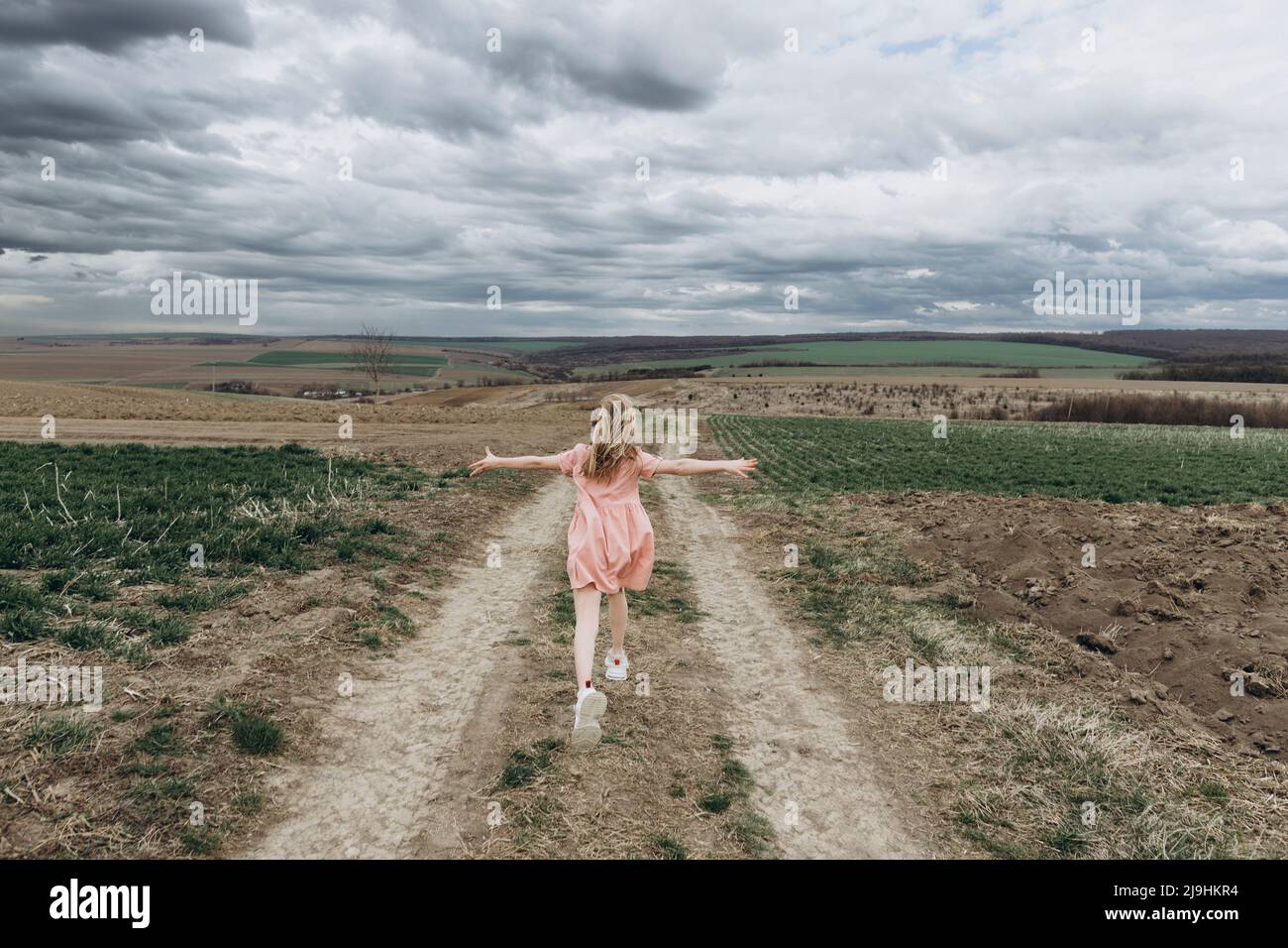 Child running on path rear view hi-res stock photography and images - Alamy