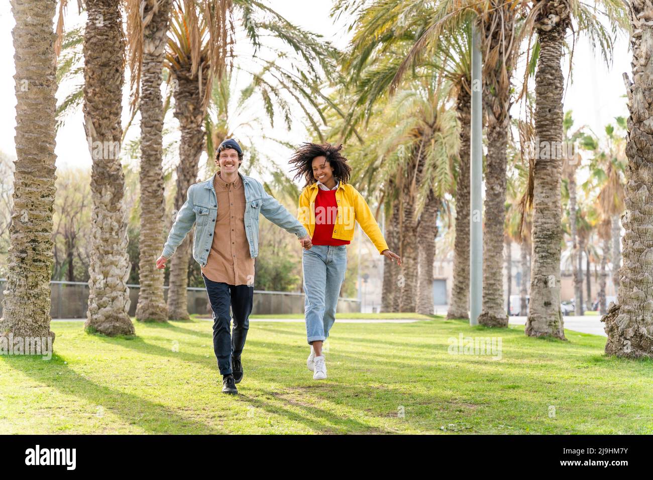 Two men running in park hi-res stock photography and images - Alamy