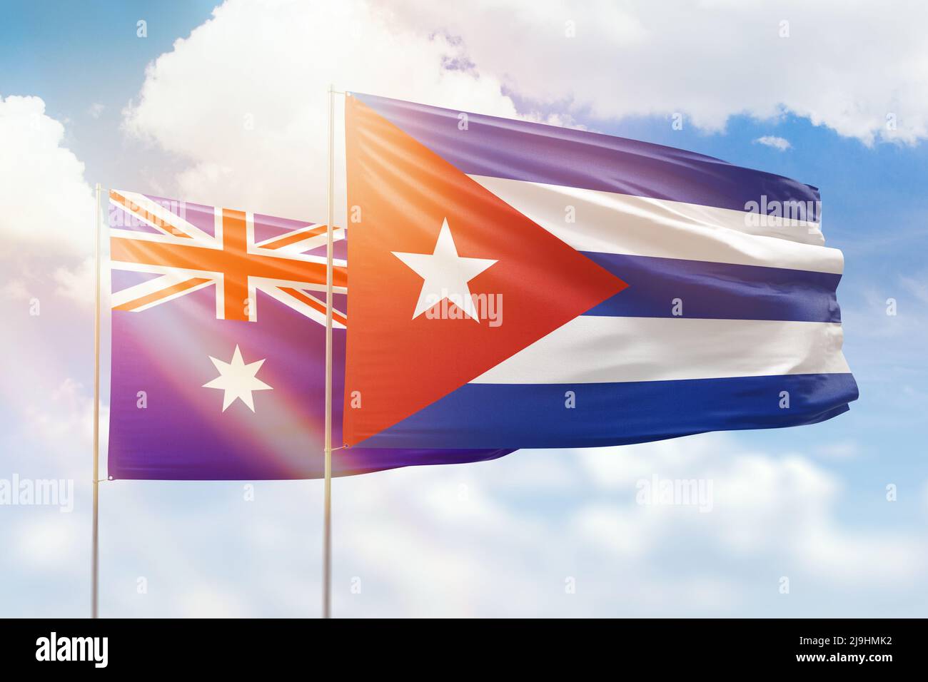 Sunny blue sky and flags of cuba and australia Stock Photo - Alamy