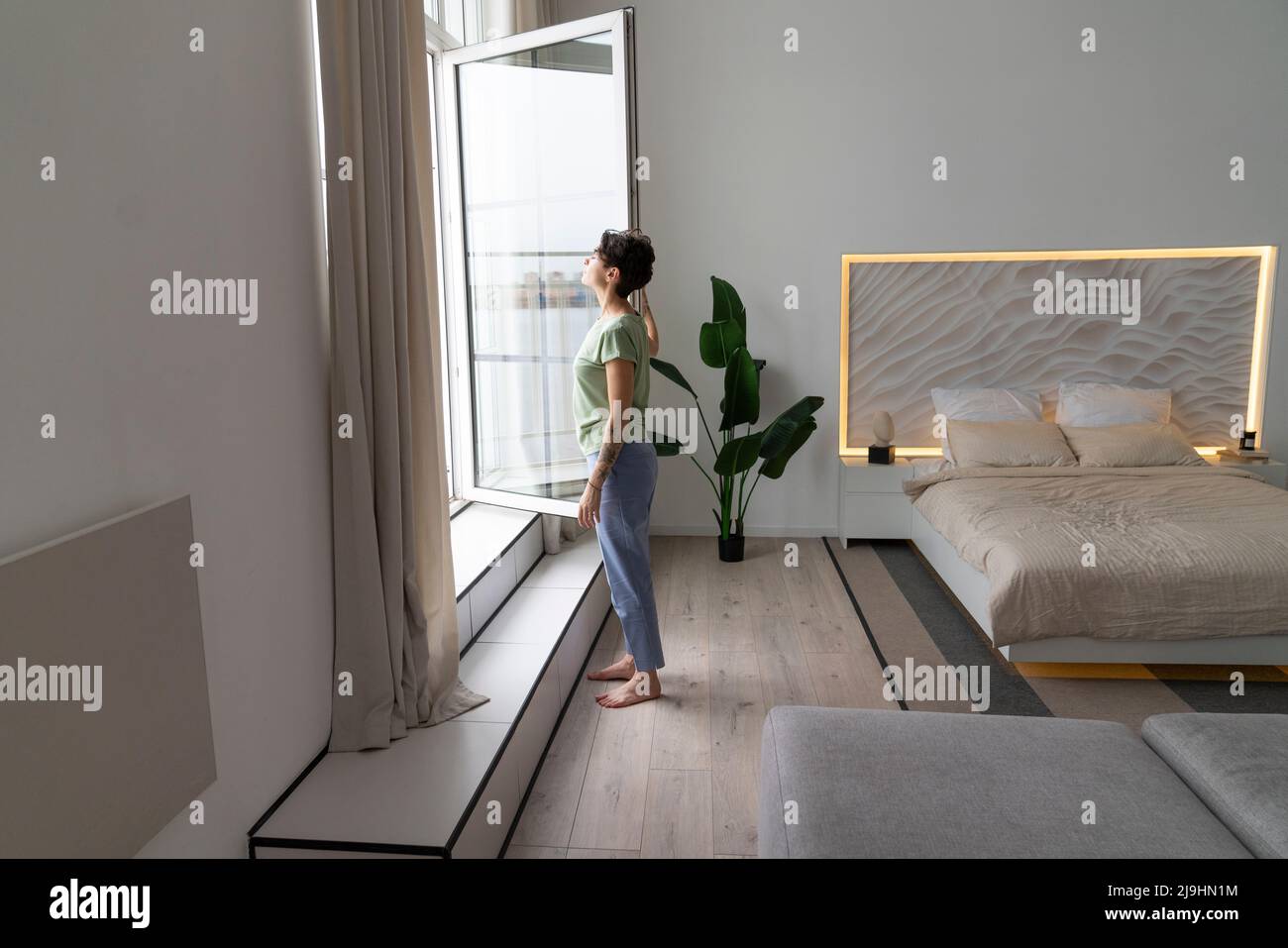 Woman breathing window hi-res stock photography and images - Alamy