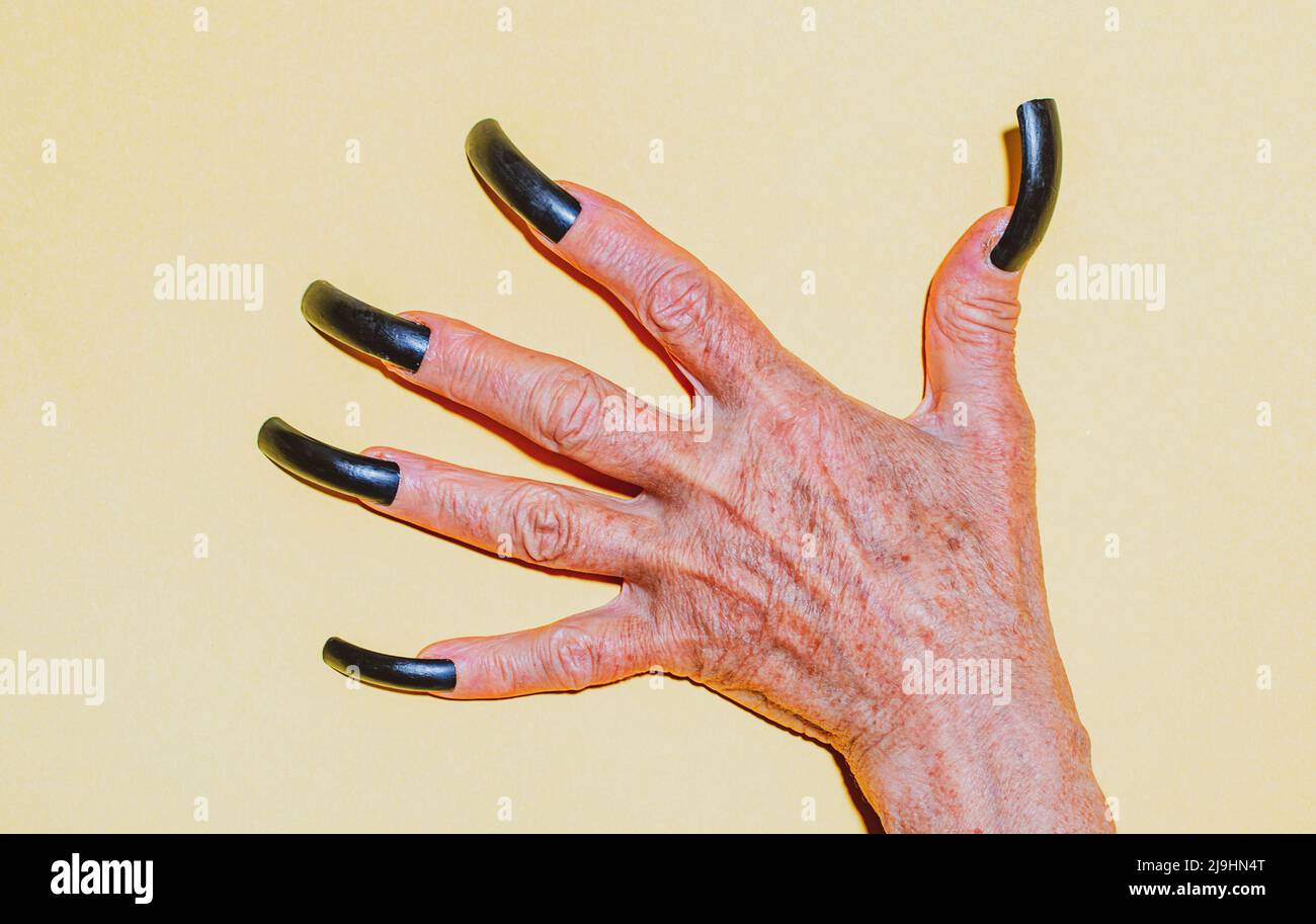 Long fingernails death hi-res stock photography and images - Alamy