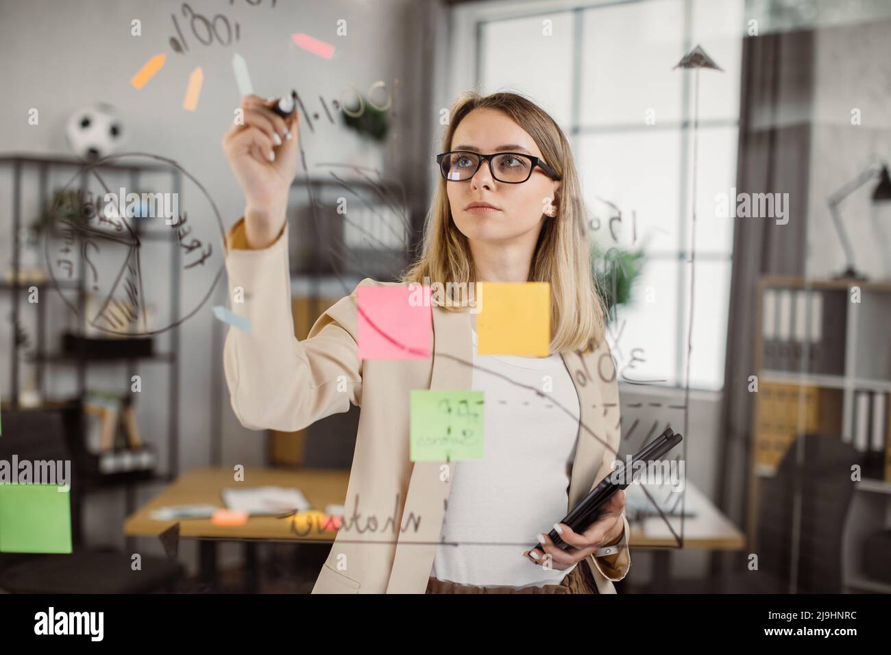 Female administrative manager preparing hi-res stock photography and ...