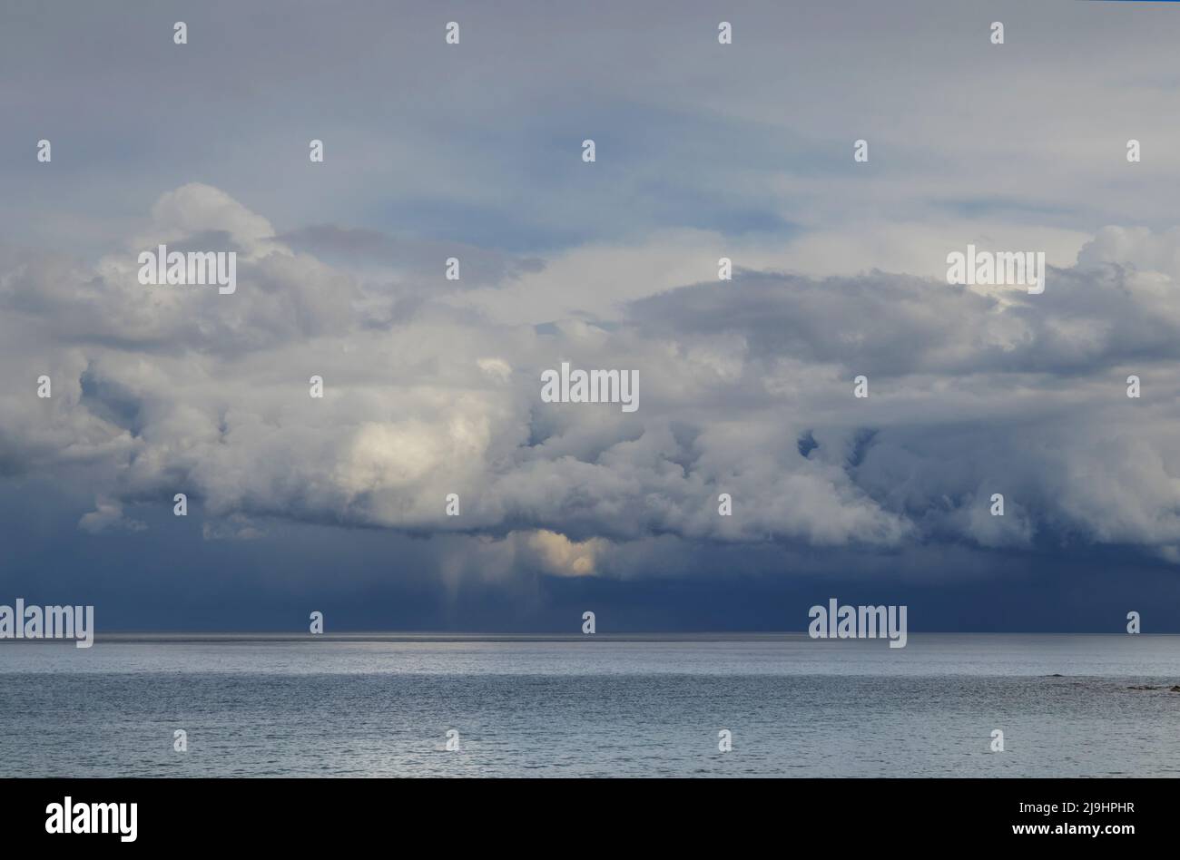 rain weather above sea beach Stock Photo - Alamy