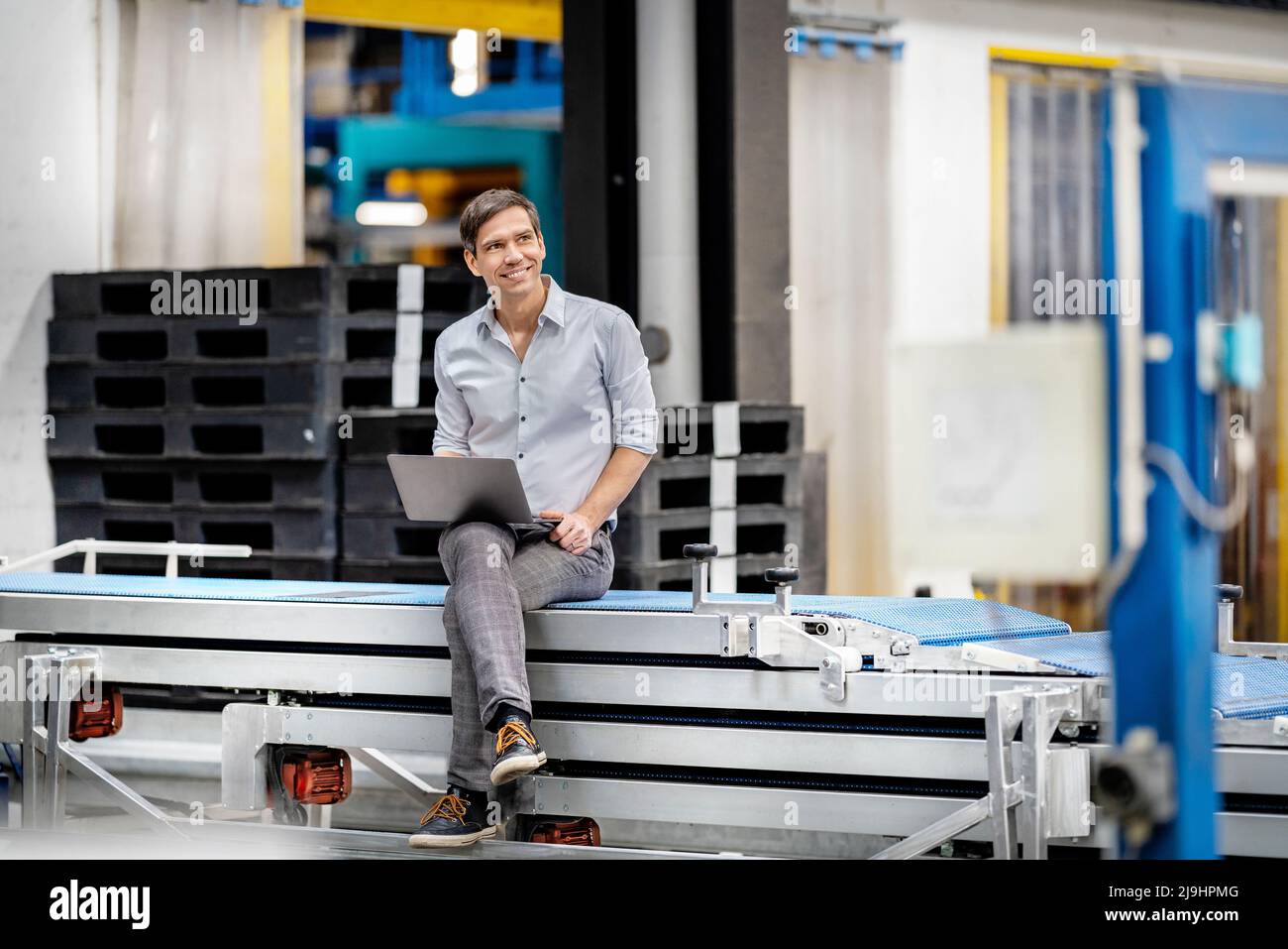 Conveyor belt laptop hi-res stock photography and images - Alamy