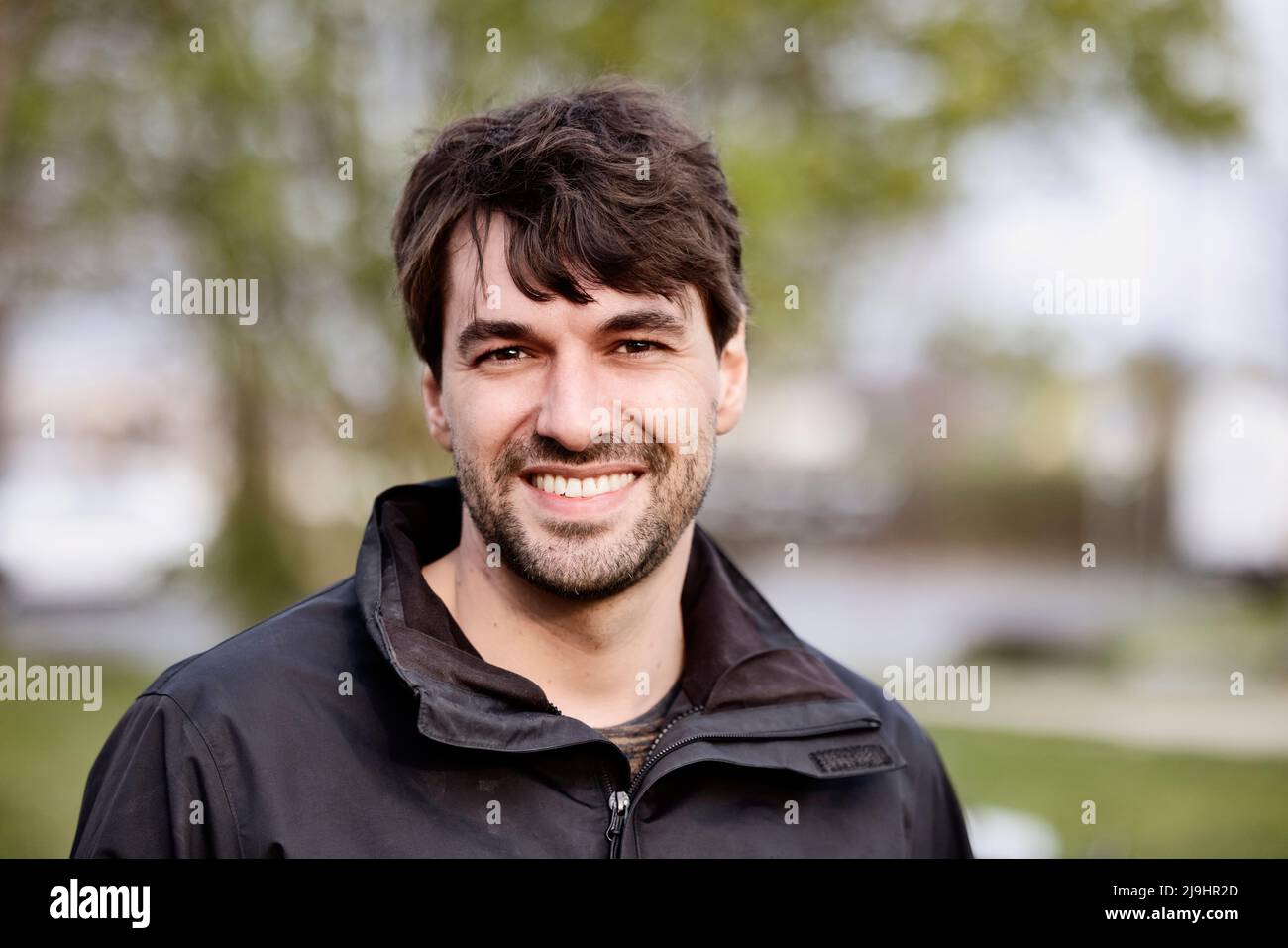 Portrait of happy man in nature Stock Photo - Alamy