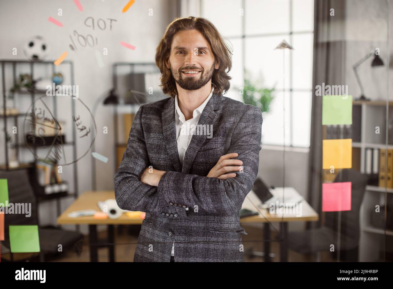 Portrait of successful company owner in plaid formaljacket posing at ...