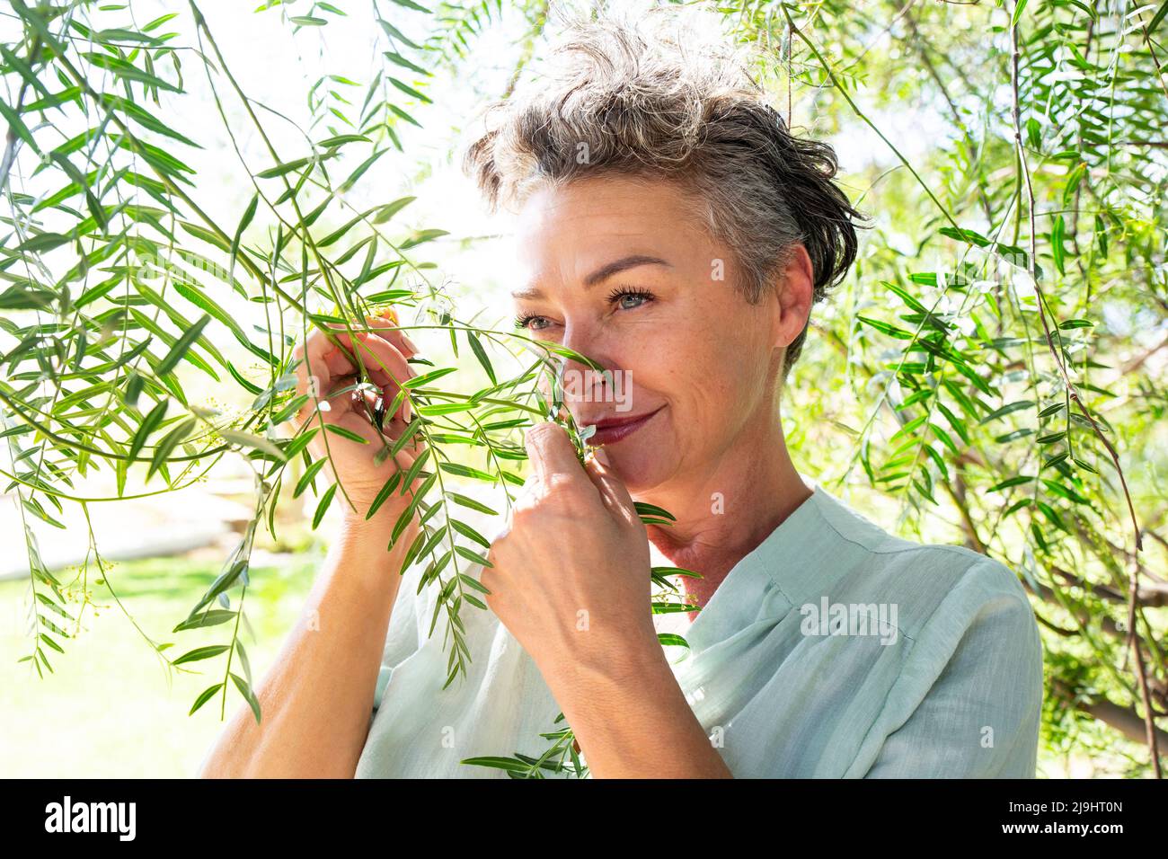Woman standing smelling hi-res stock photography and images - Alamy