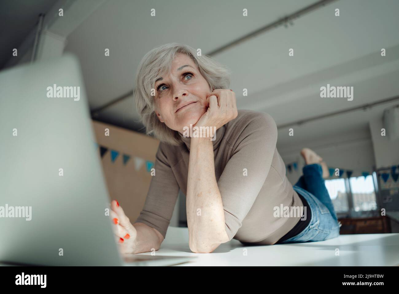 Businesswoman work lying on desk hi-res stock photography and images ...