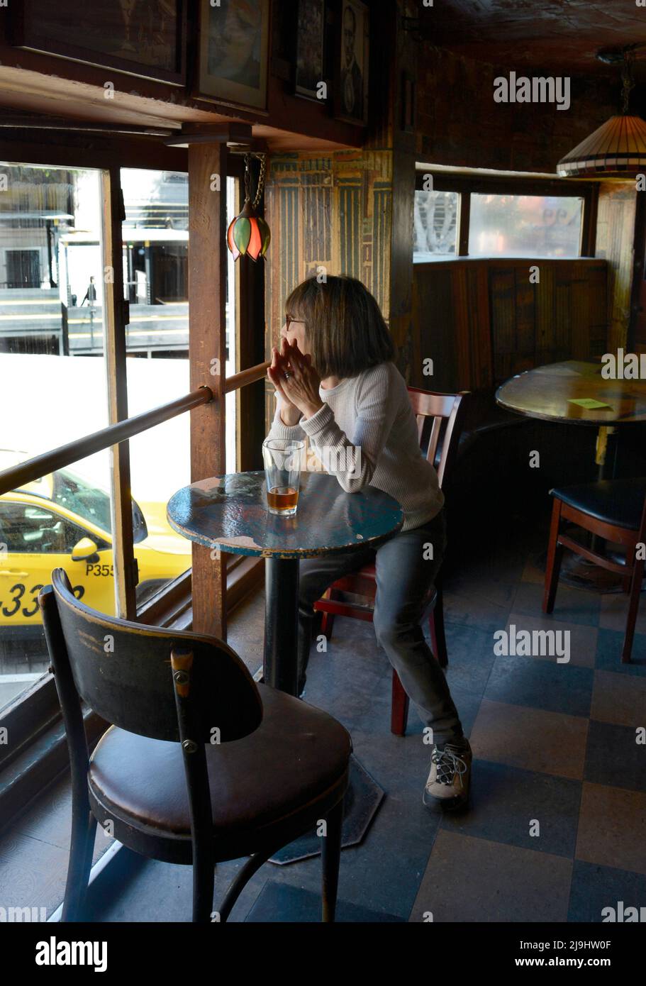 A woman enjoys a beer at the Vesuvio Cafe, a landmark American bar in ...