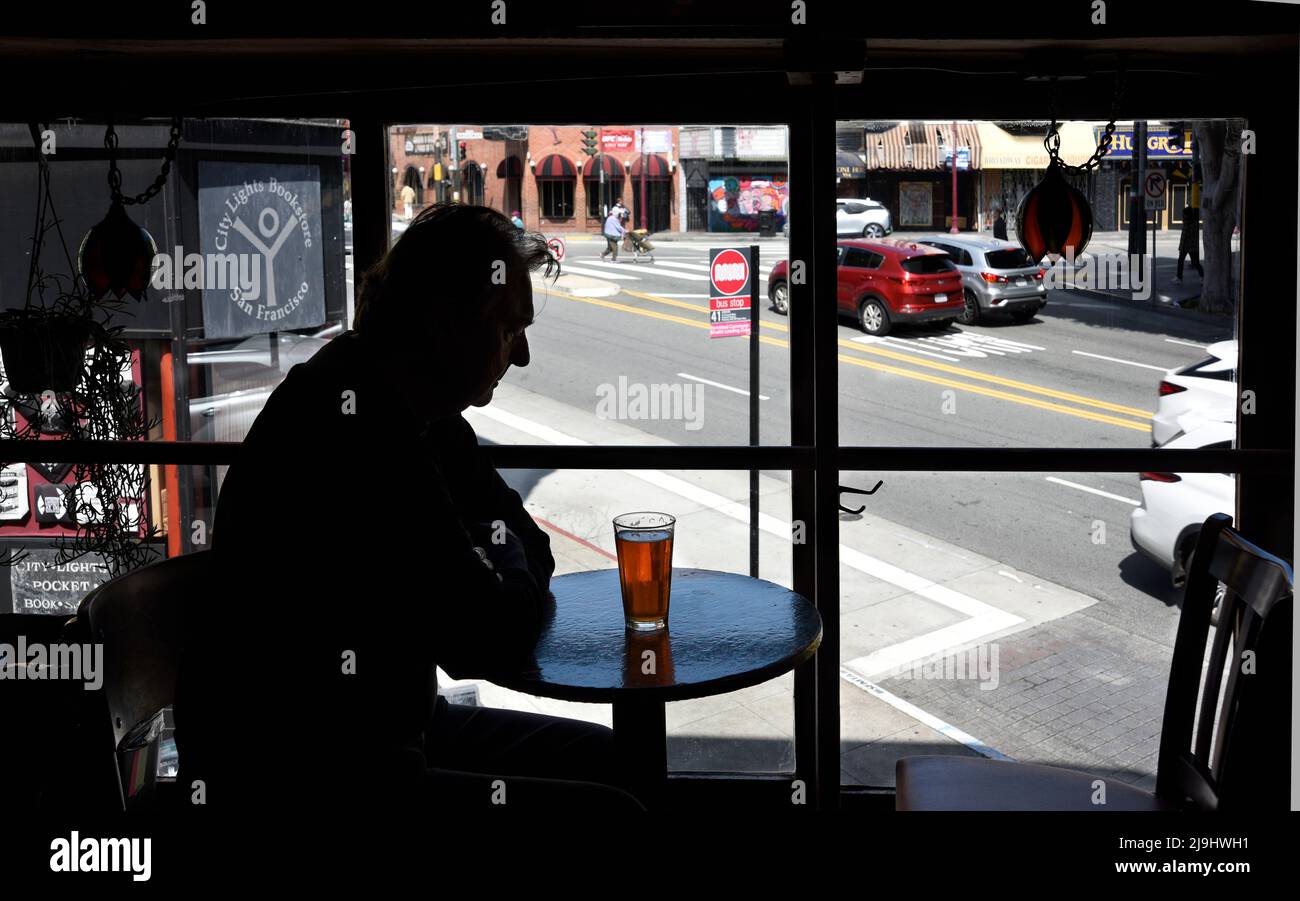 A man enjoys a beer at the Vesuvio Cafe, a landmark American bar in the ...