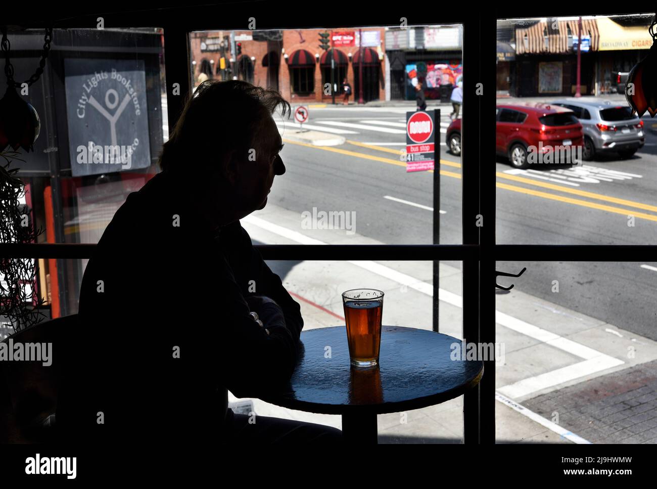 A man enjoys a beer at the Vesuvio Cafe, a landmark American bar in the ...