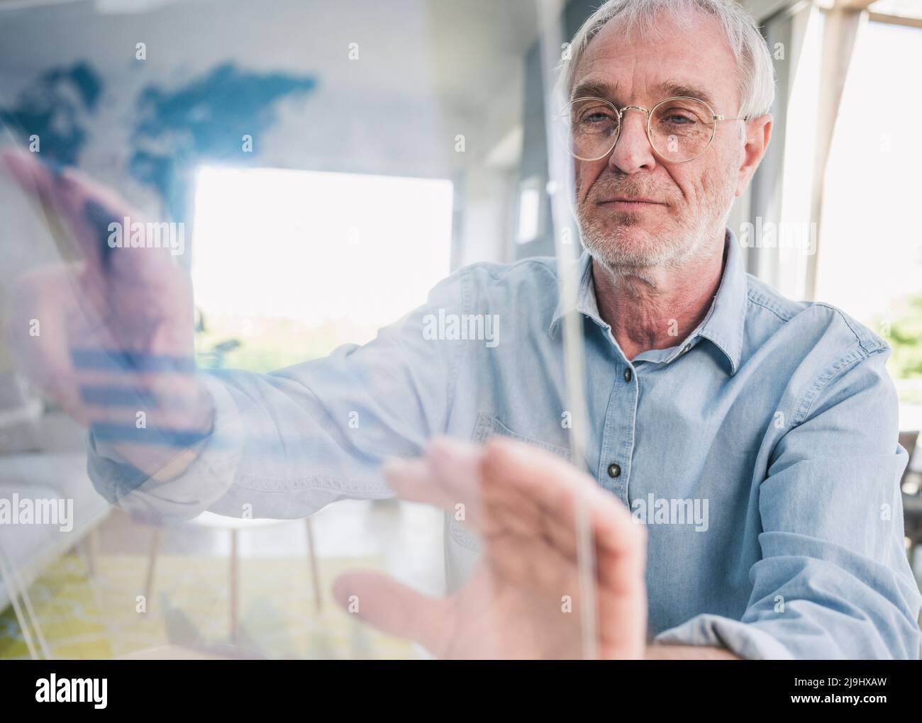 Freelancer using futuristic transparent screen at home Stock Photo - Alamy