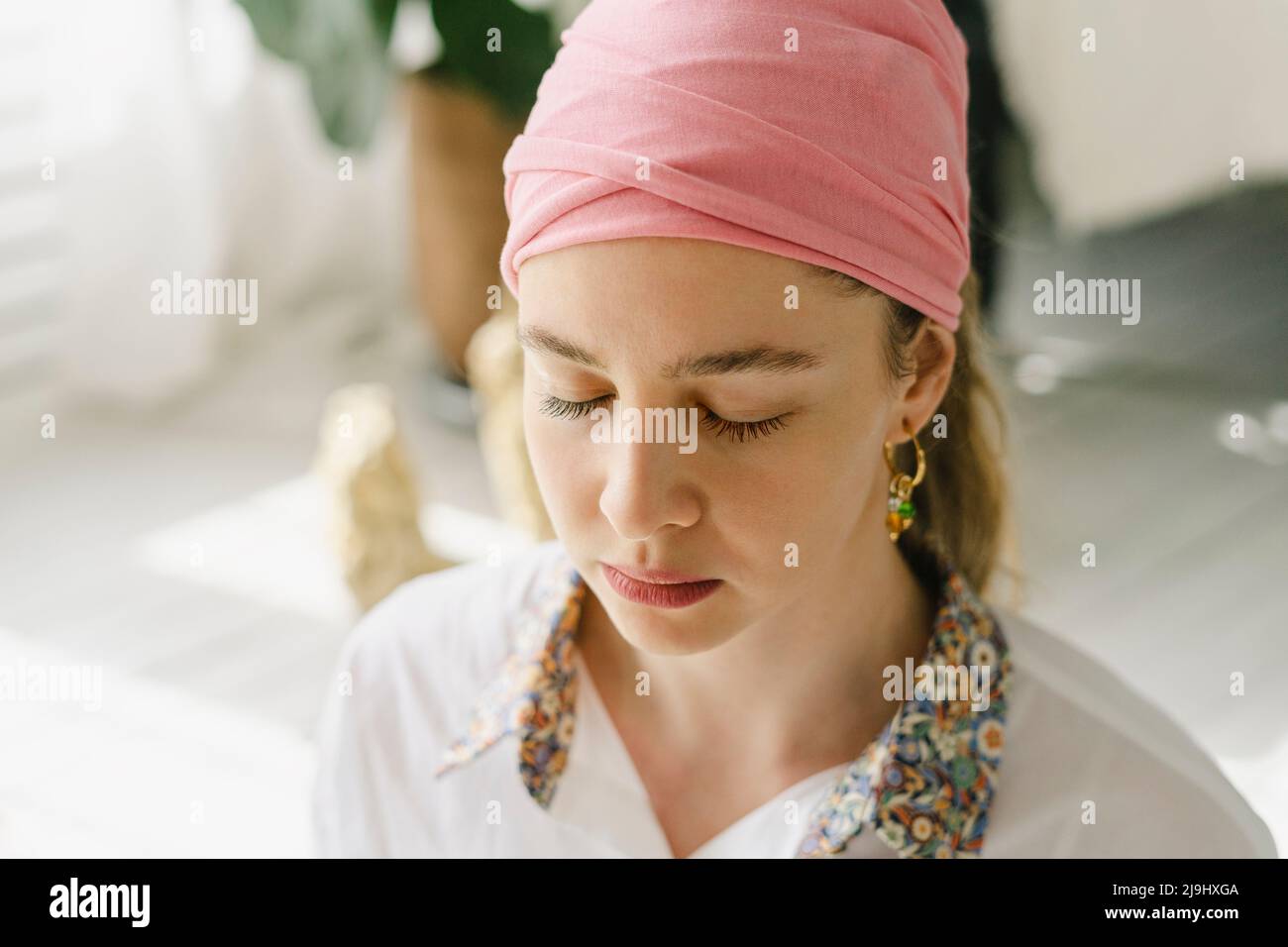 Meditating woman front face hi-res stock photography and images - Alamy