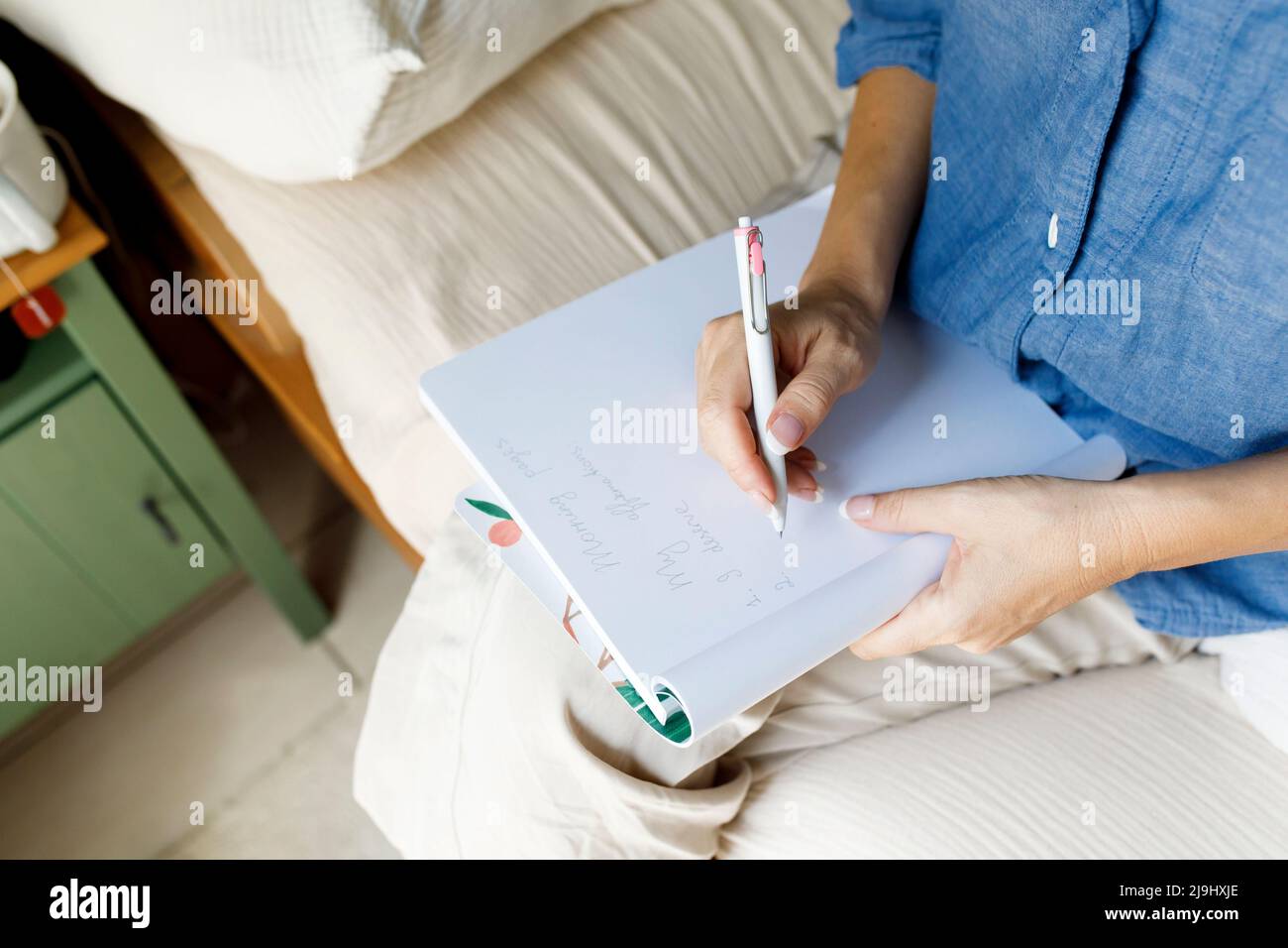 Woman notepad bed hi-res stock photography and images - Alamy